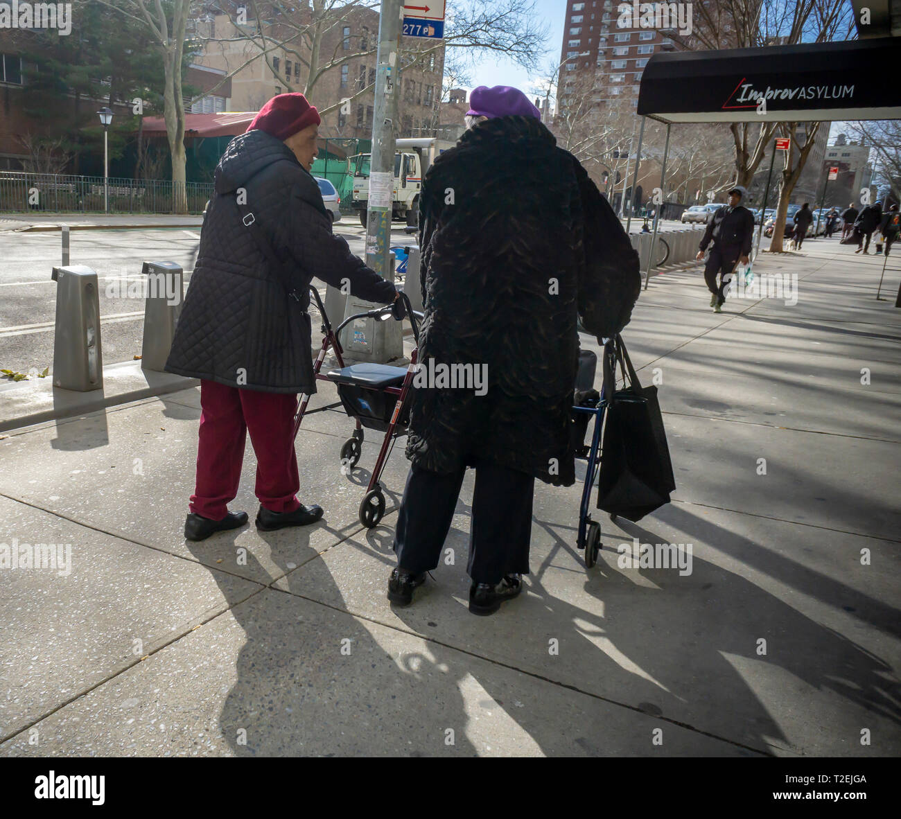 Elderly women using their walkers in the New York neighborhood of ...