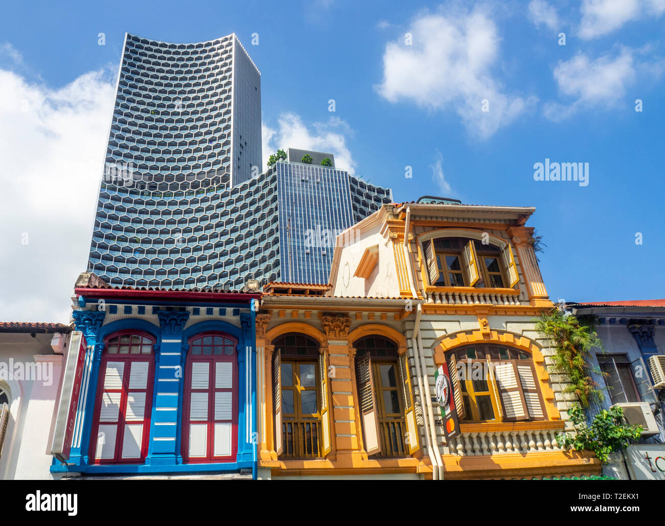 DUO office towers over Arab Street traditional shophouses fabric shops ...