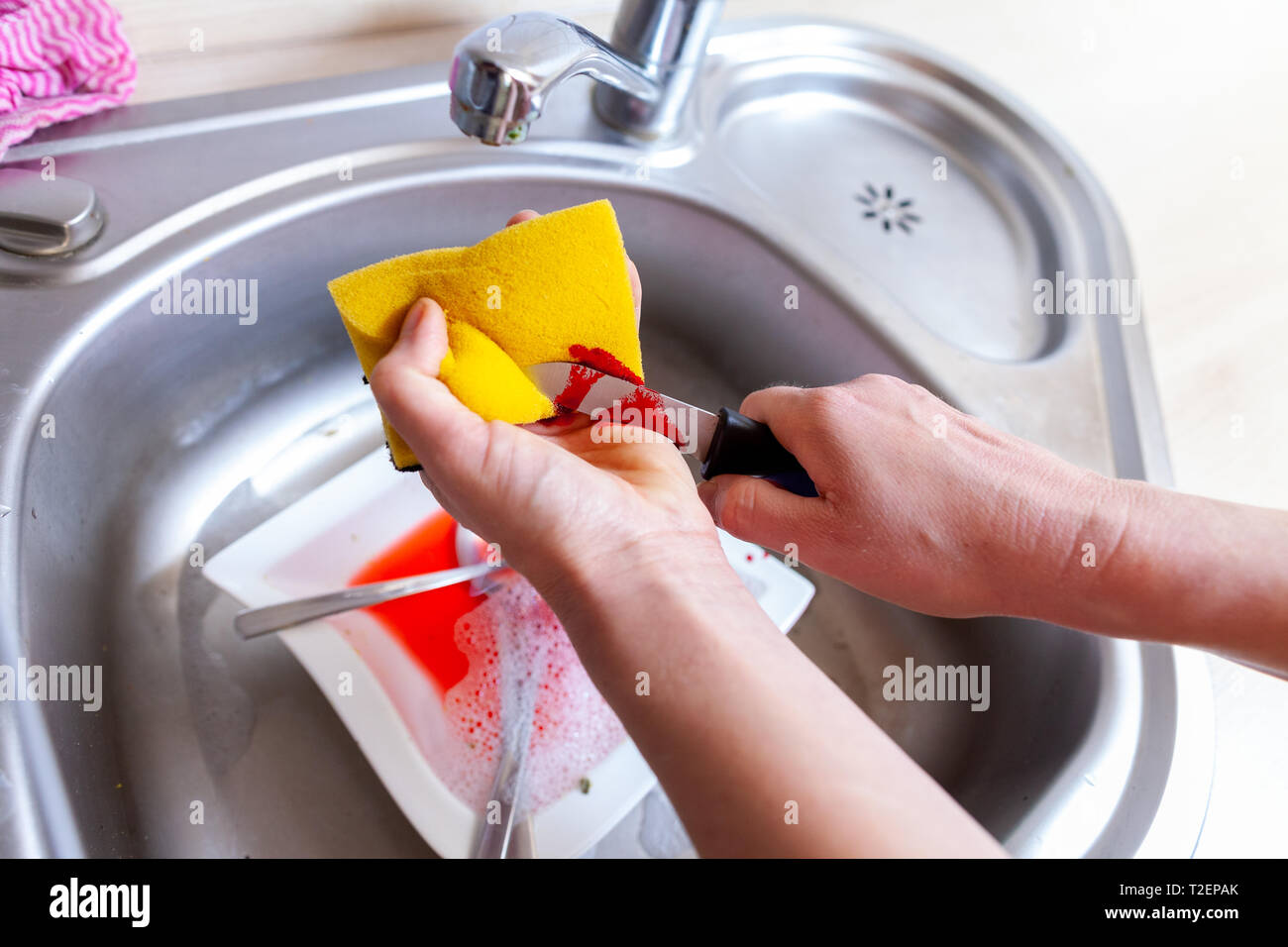 Bloody knife in sink hi-res stock photography and images - Alamy