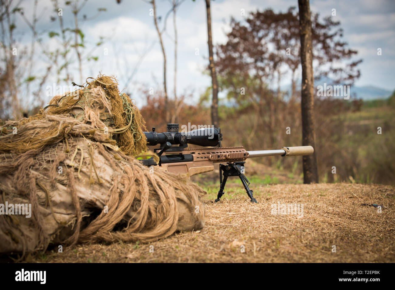 A U.S. Marine scout sniper prepares to fire during joint live fire ...