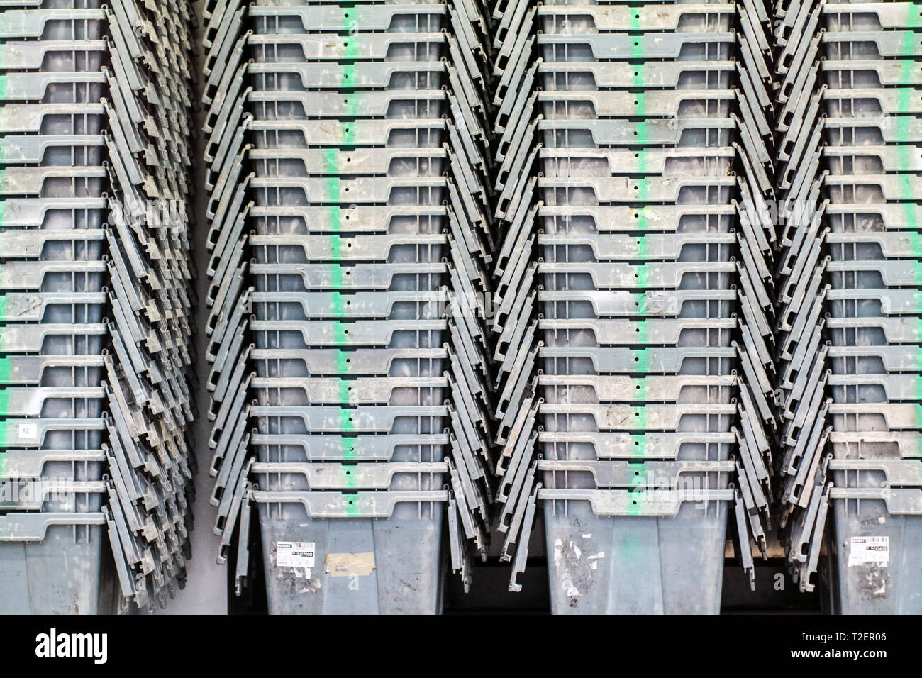 Plastic containers are stacked perfectly together to wait for the ...