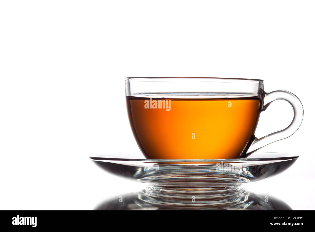 Cup of black tea and spoon, isolated on white Stock Photo - Alamy