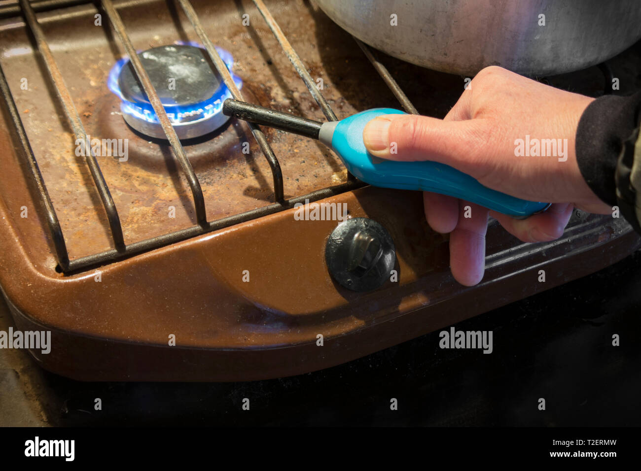 Hand gas lighter stove hi-res stock photography and images - Alamy