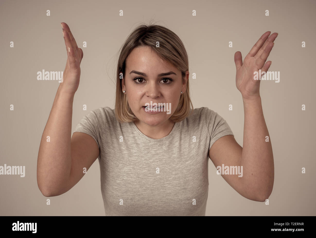 Close up of young attractive caucasian woman with an angry face ...