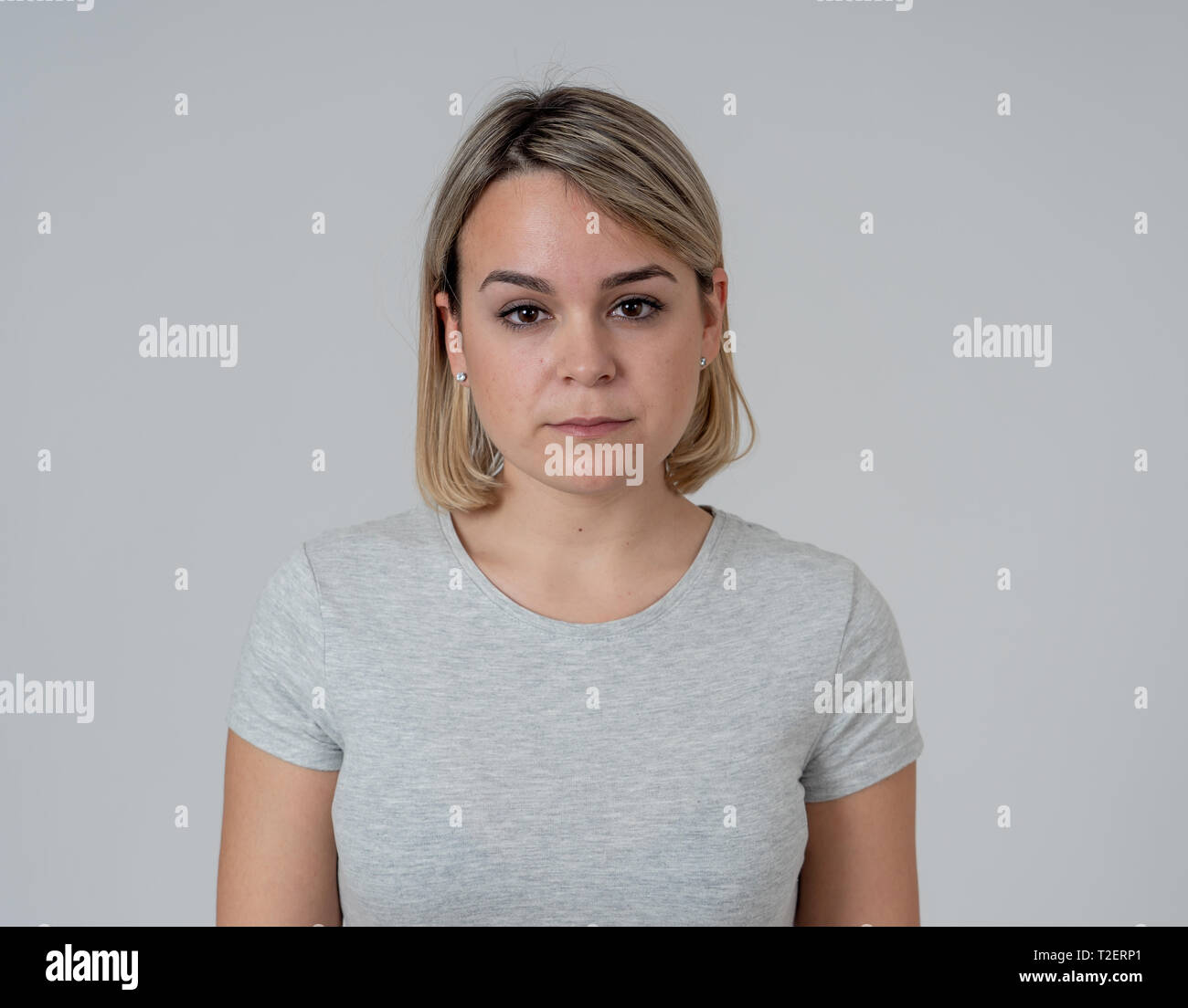 Close up of young attractive caucasian woman with an angry face ...