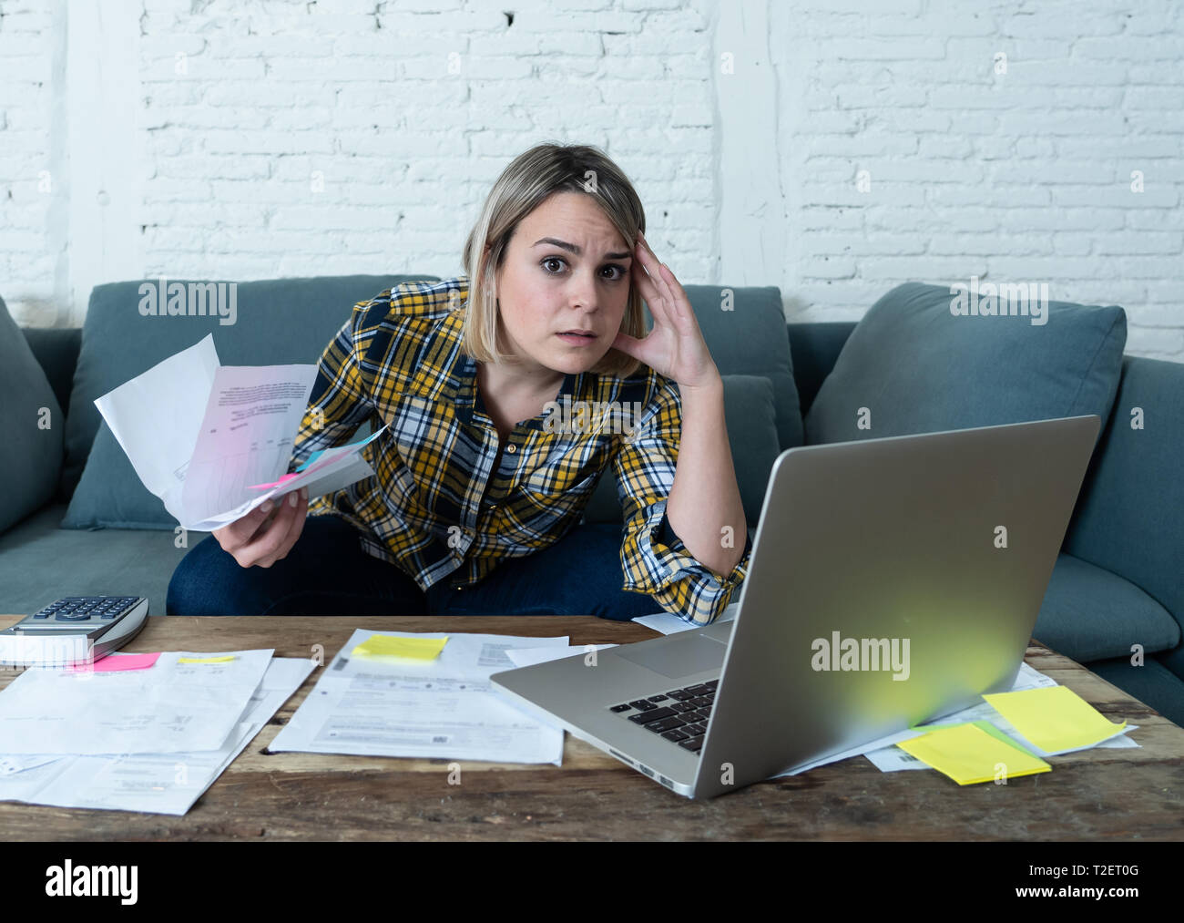 Portrait of desperate young woman feeling stressed checking online ...