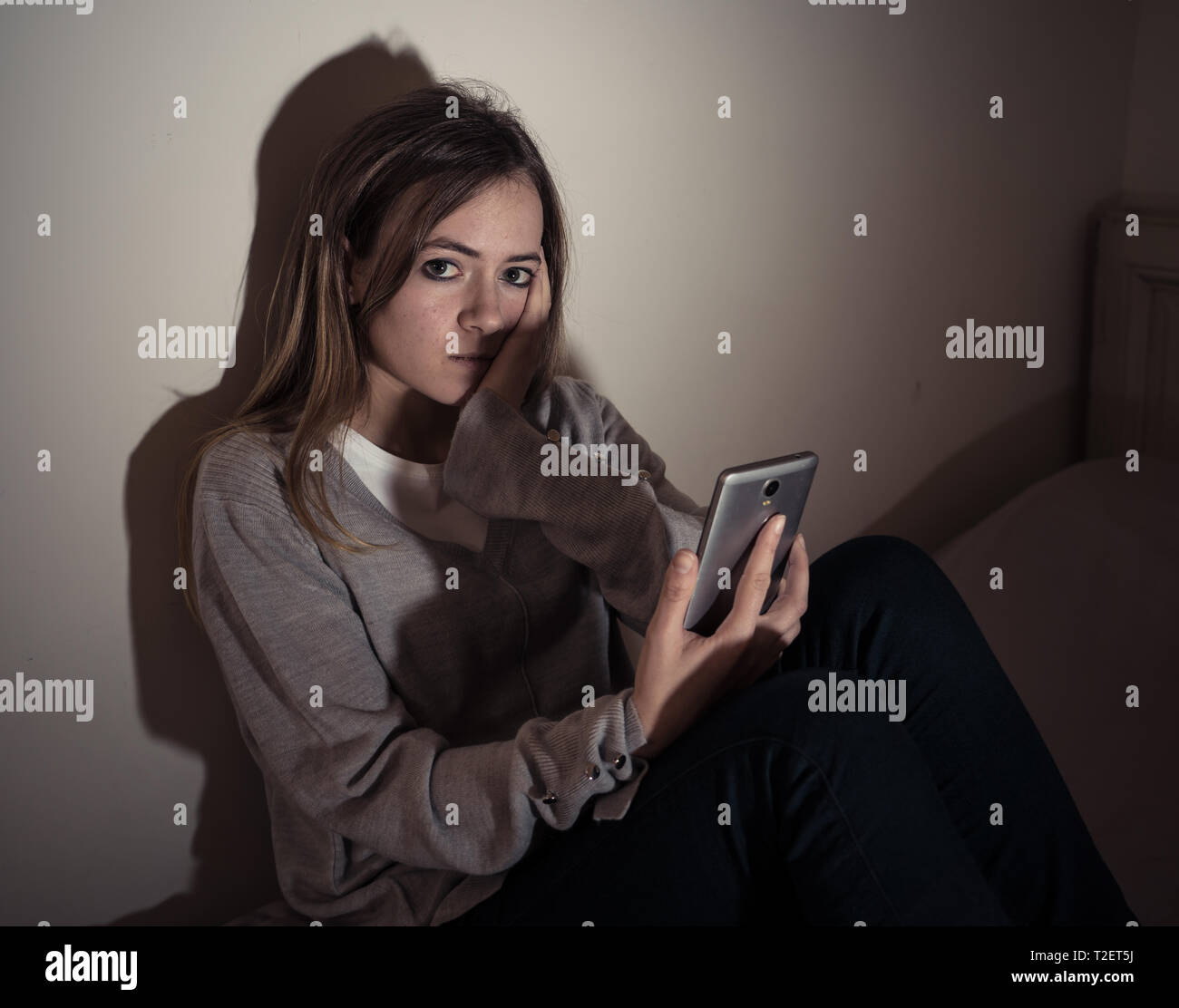 Young teenager girl suffering mobile cell phone addiction feeling ...