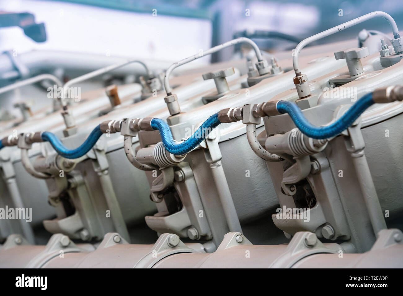 Diesel engine parts with tubing connecting cylinders Stock Photo - Alamy