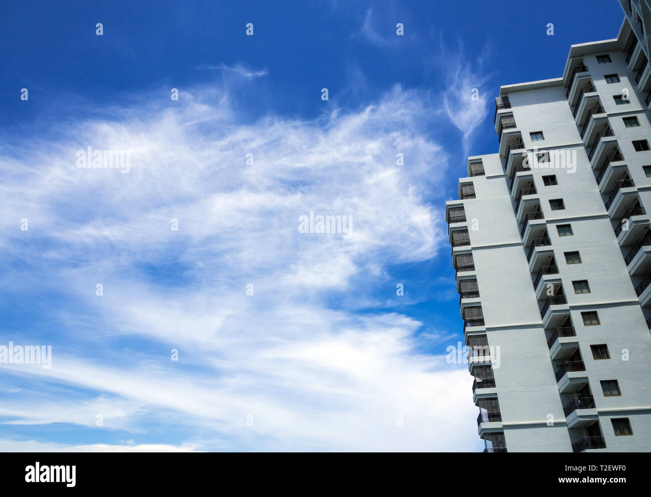 High-rise building and bright blue sky Stock Photo - Alamy