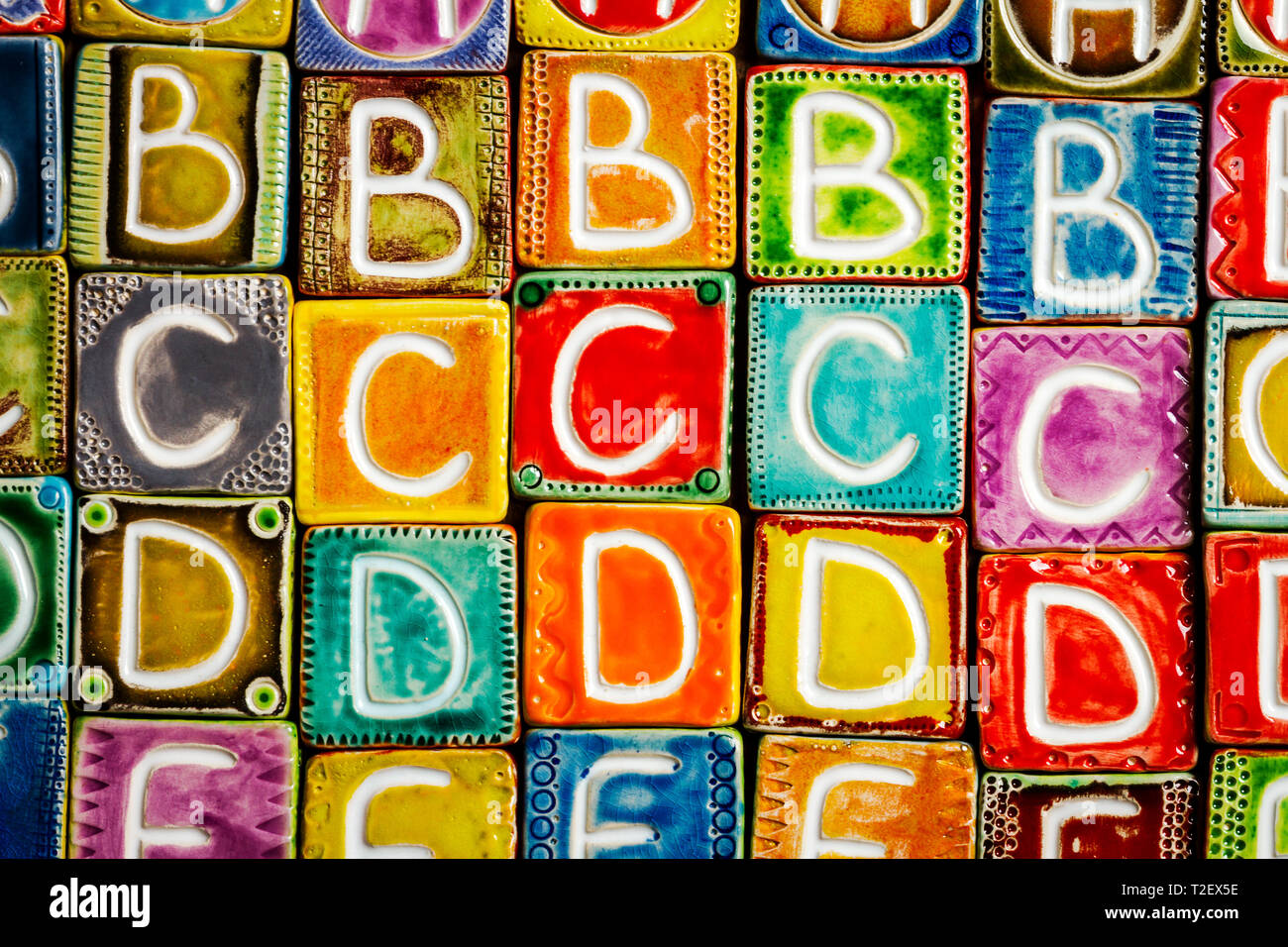 Background from colorful handmade ceramic letters Stock Photo - Alamy