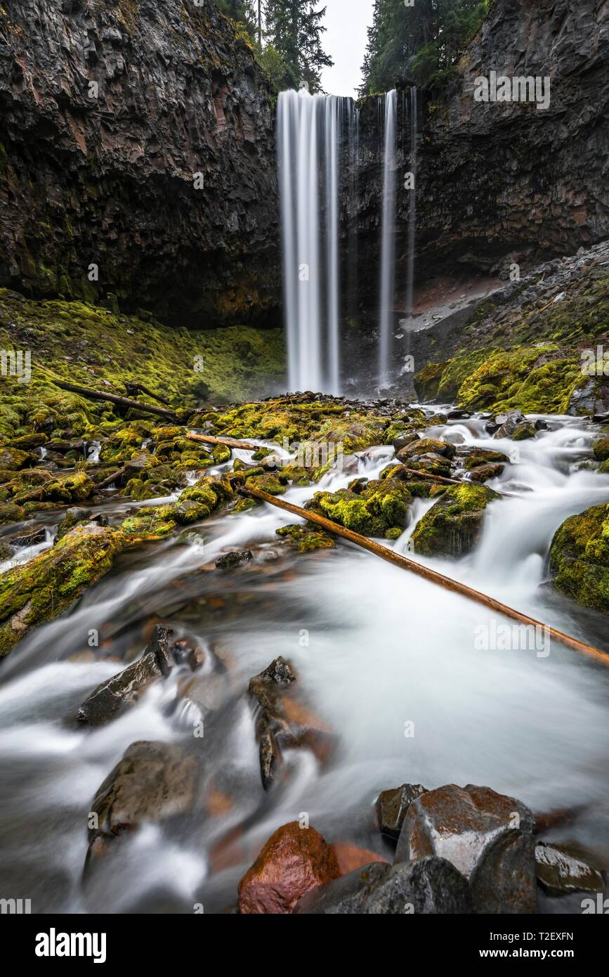 Waterfall flows over rocky outcrop, long term exposure, River Cold ...
