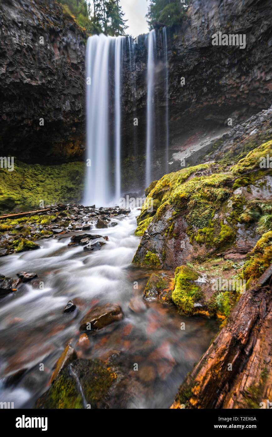 Waterfall flows over rocky outcrop, long term exposure, River Cold ...