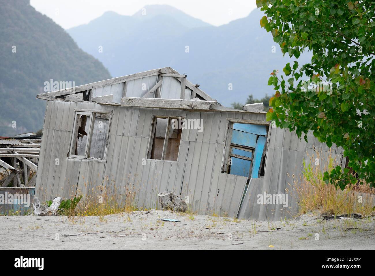 Destroyed house during volcanic eruption of Chaiten volcano in 2008 ...