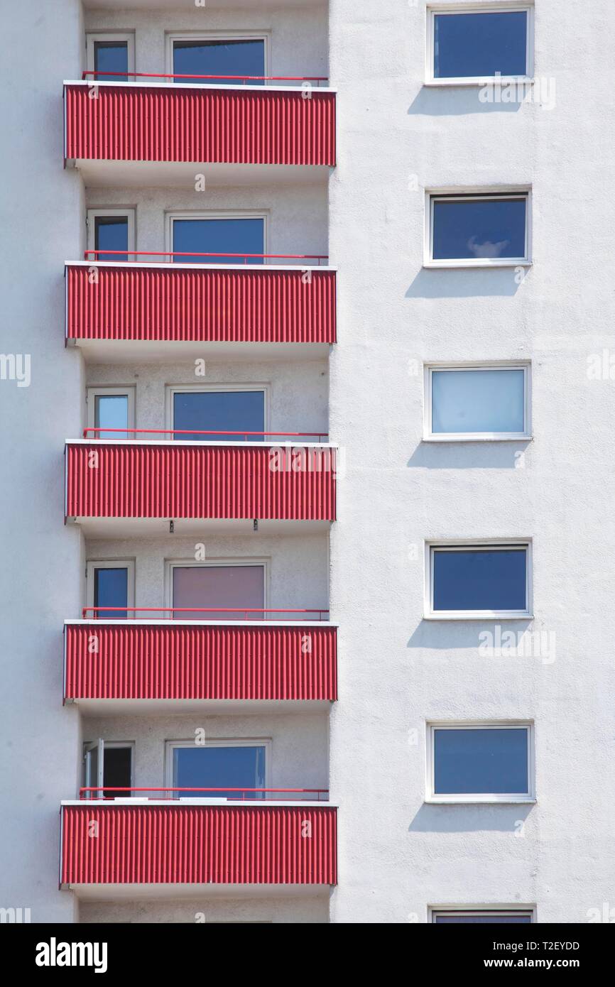 Monotonous house facade with balconies on a white residential house hi ...