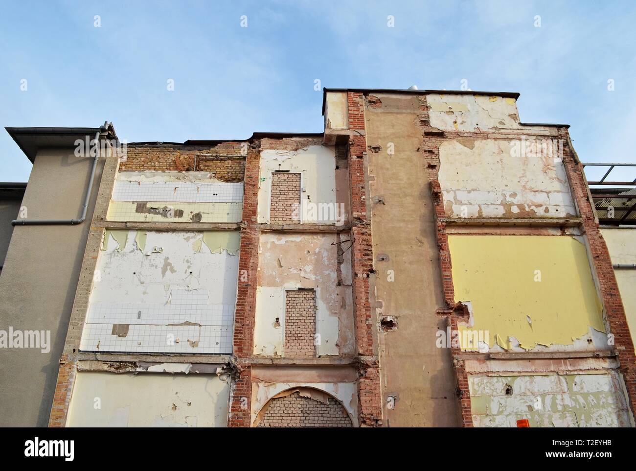 Demolition of a house, facade of a demolition house, doors and windows ...