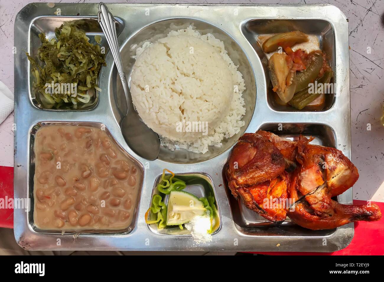 Typical meal with chicken, rice and beans, Tanzania Stock Photo - Alamy