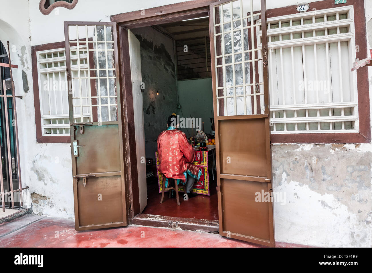 A Chinese praying at his home in George Town, Penang Stock Photo - Alamy