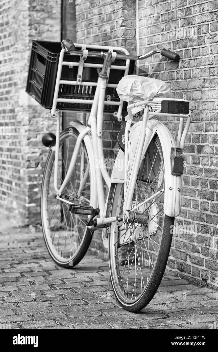 Vintage bicycle against a wall Black and White Stock Photos & Images ...
