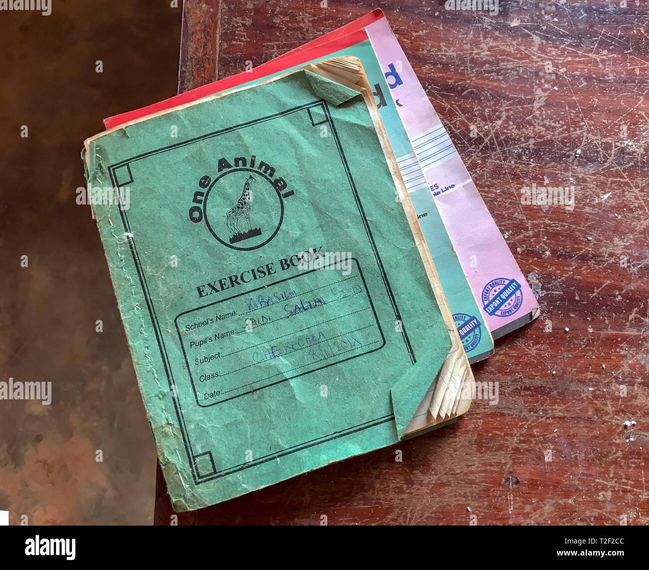 Exercise books on a school bench hi-res stock photography and images ...