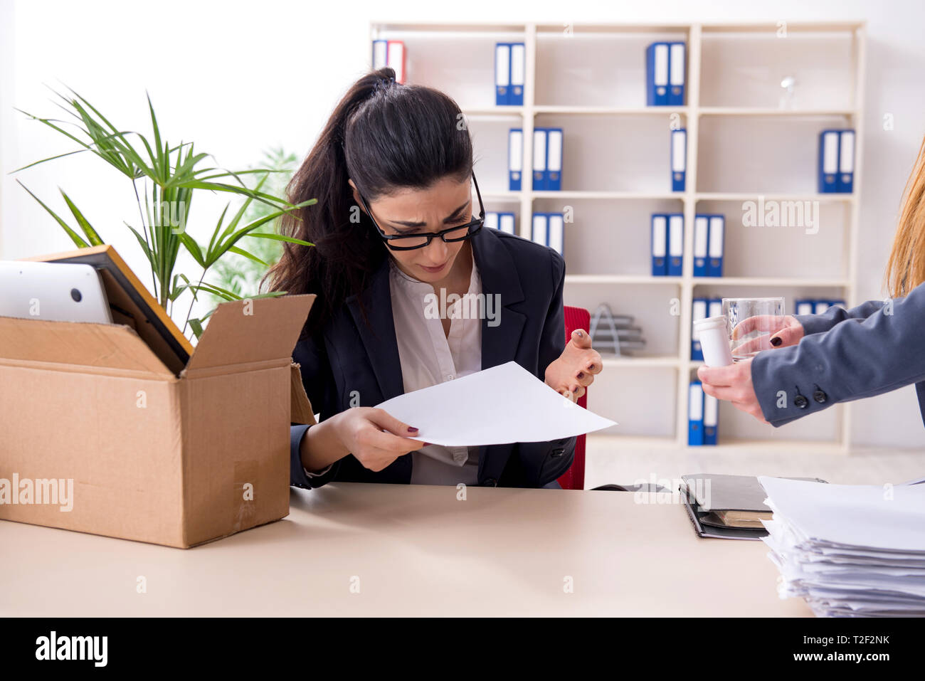 Young female employee being fired from her work Stock Photo - Alamy