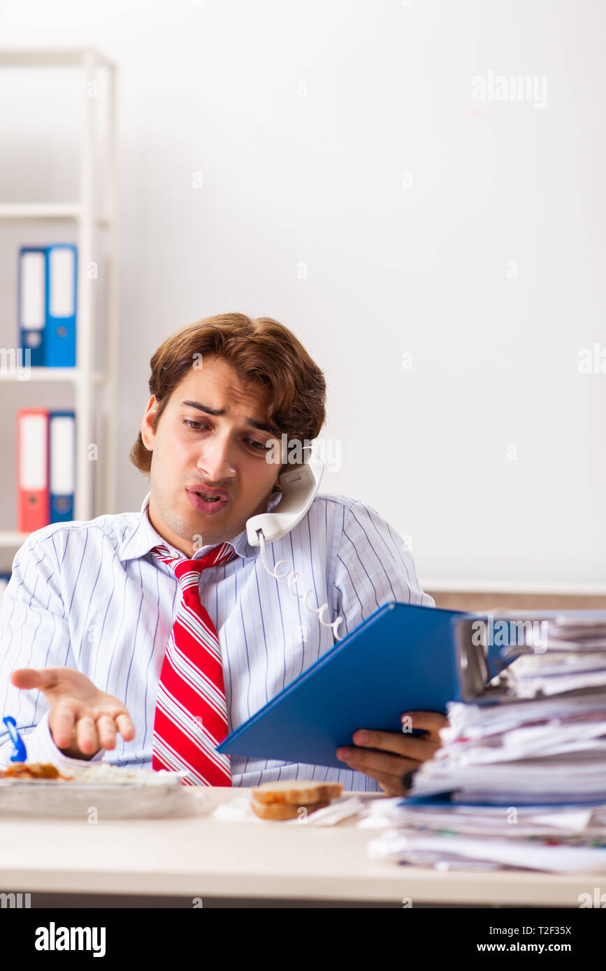 Man having meal at work during break Stock Photo - Alamy