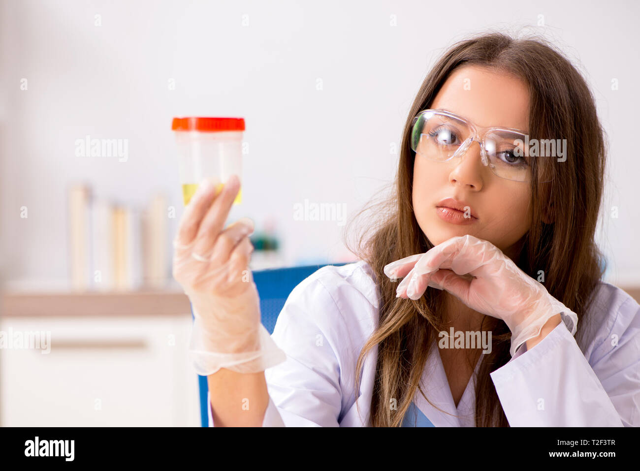 Female beautiful biochemist working in the lab Stock Photo - Alamy