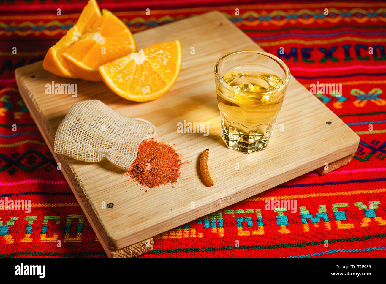 Mezcal shot with chili, salt agave worm, mexican drink in Oaxaca Mexico ...