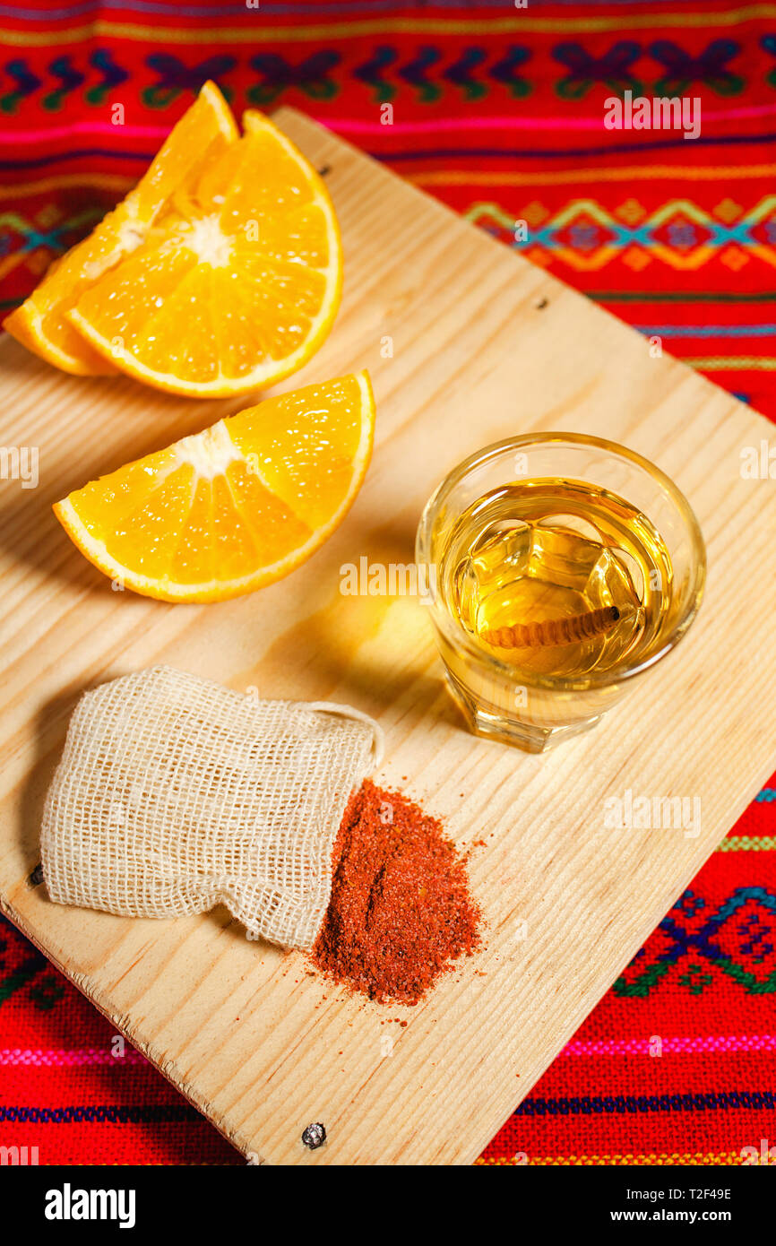 Mezcal shot with chili, salt agave worm, mexican drink in Oaxaca Mexico ...