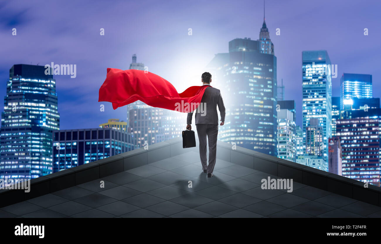 Superhero businessman on top of building Stock Photo - Alamy