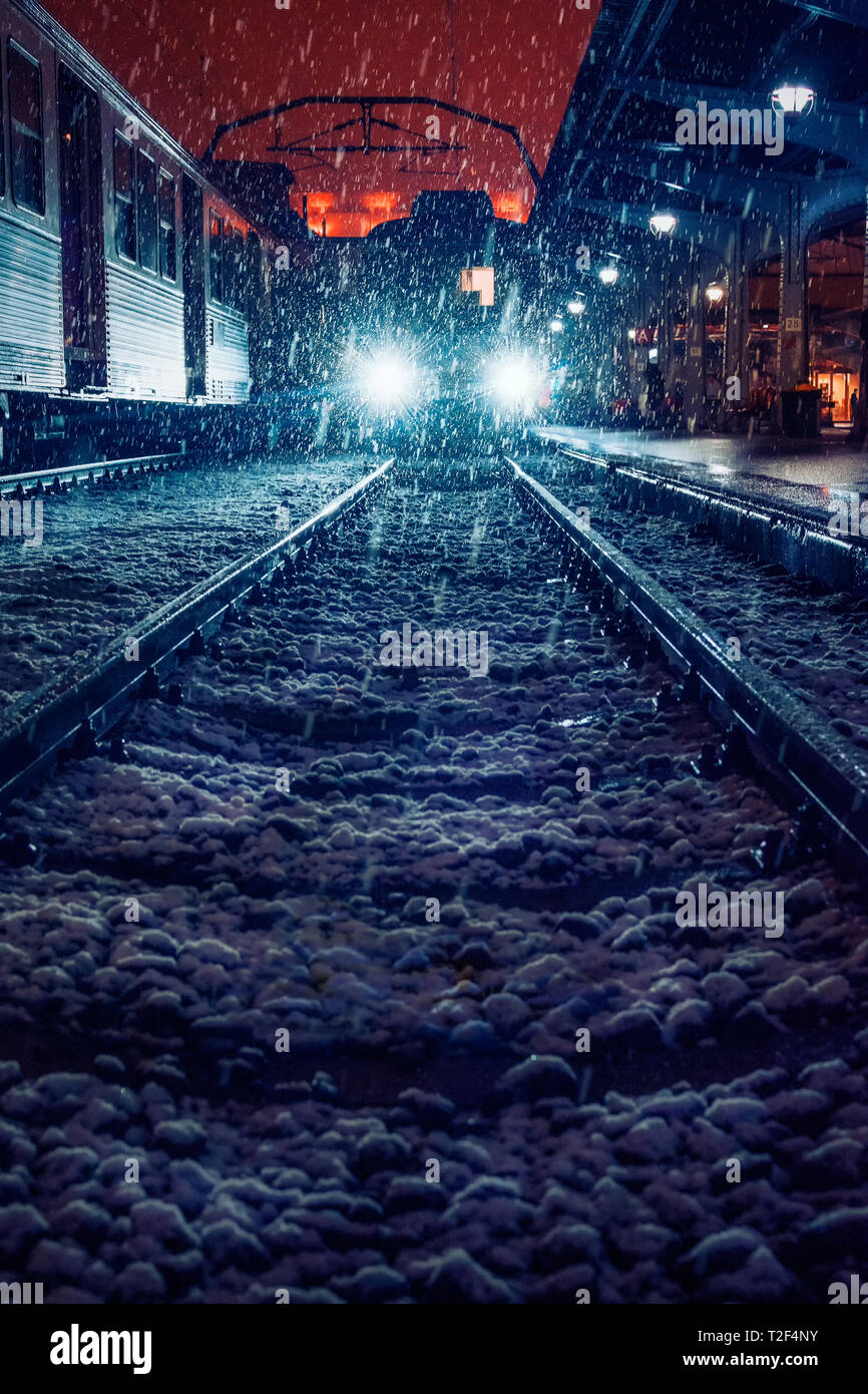 Beautiful train shot with a snow storm in the train station in the ...