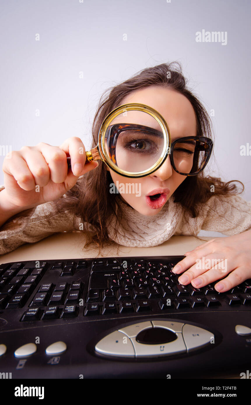 Funny nerd girl working on computer Stock Photo - Alamy