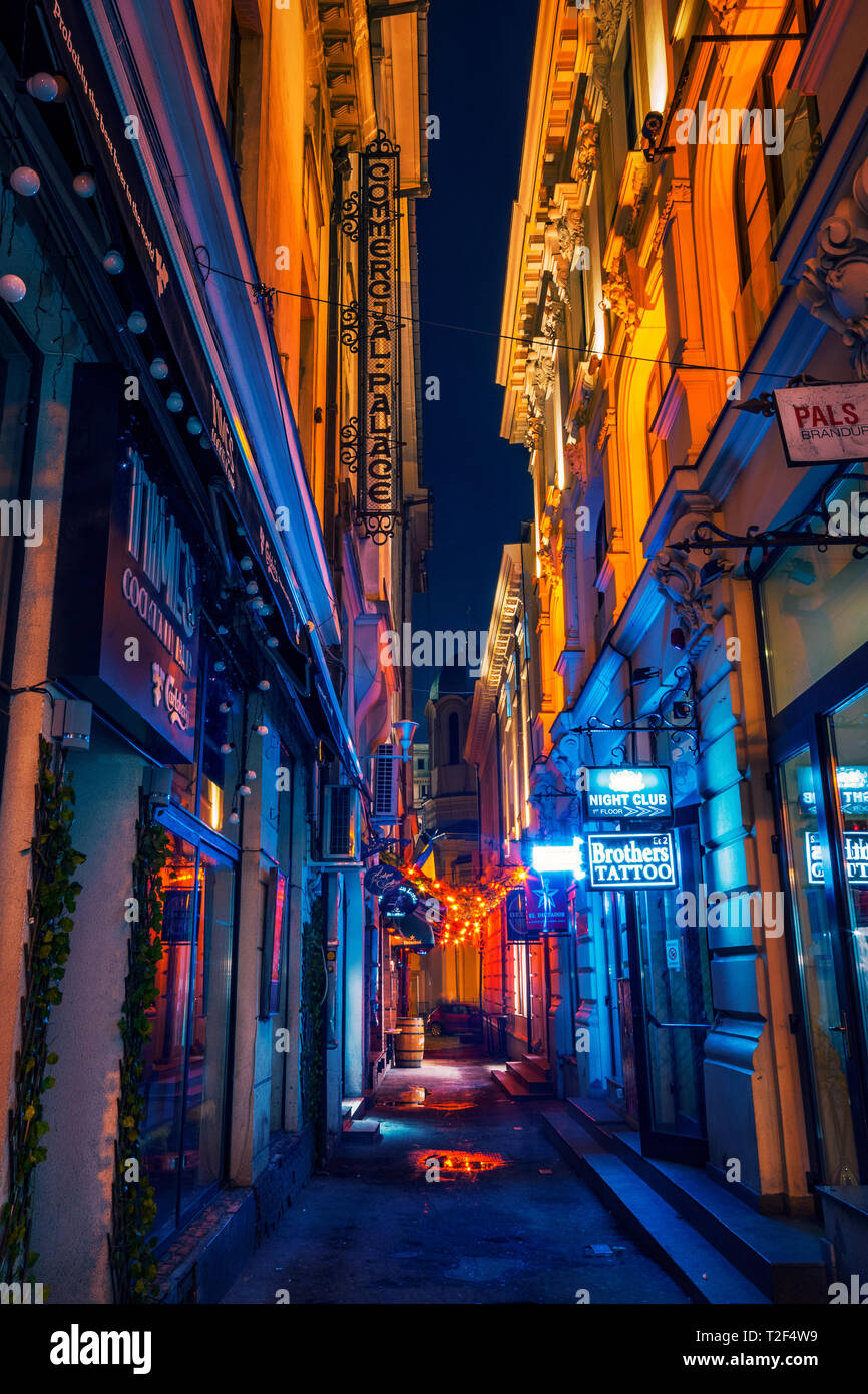Beautiful narrow alley with night clubs and cocktail bars shot in the ...