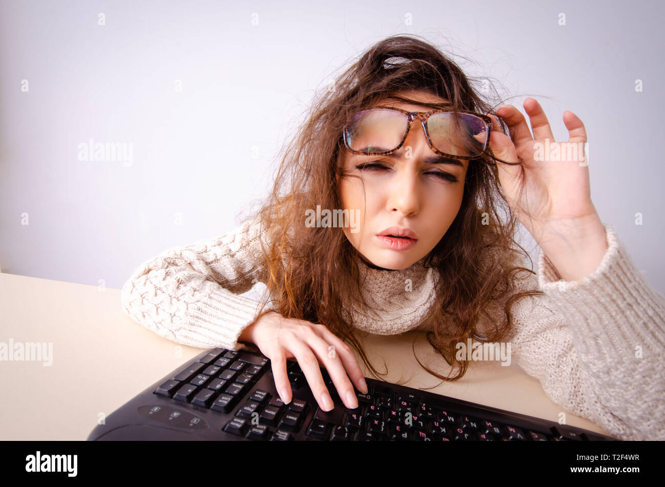 Funny nerd girl working on computer Stock Photo - Alamy