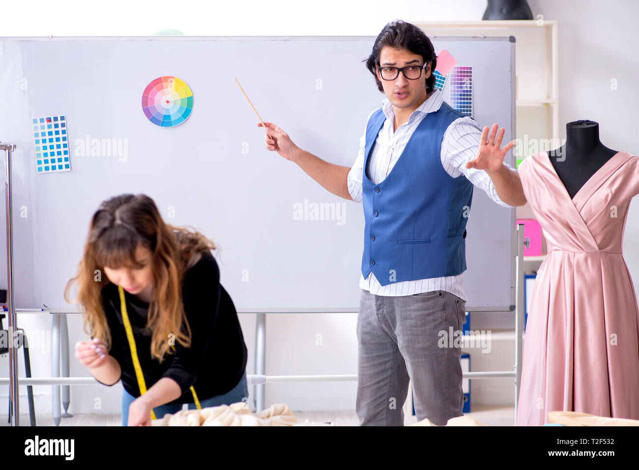 Tailor student cutting fabric hi-res stock photography and images - Alamy