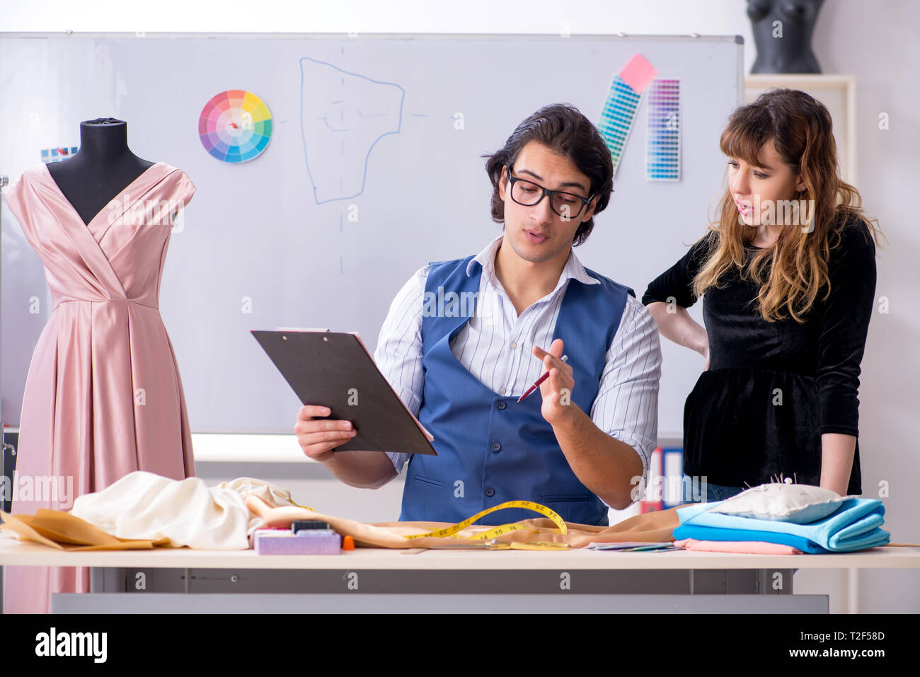 Young tailors working in workshop Stock Photo - Alamy