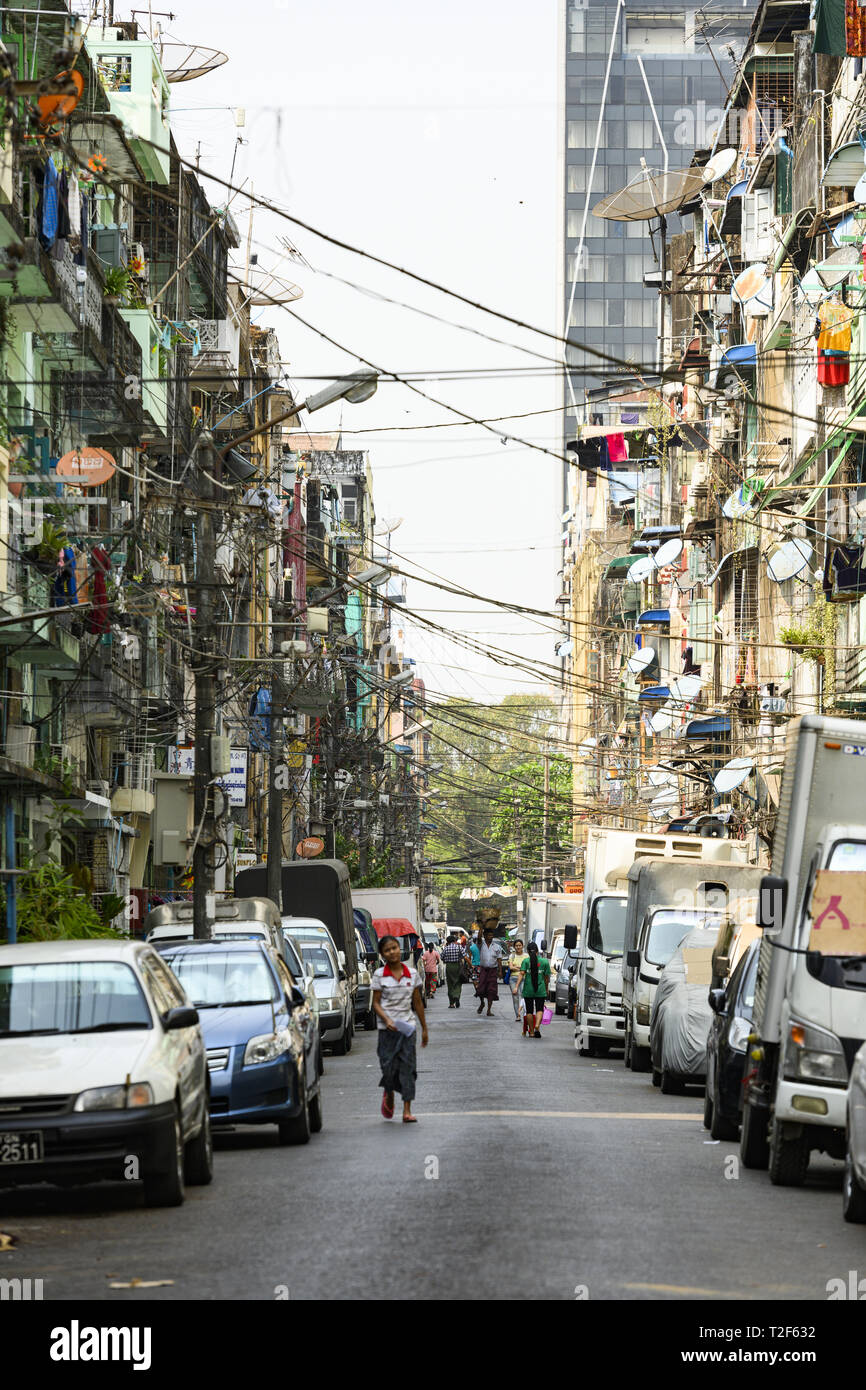 Daily traffic and city life on the narrow streets of Yangon during ...