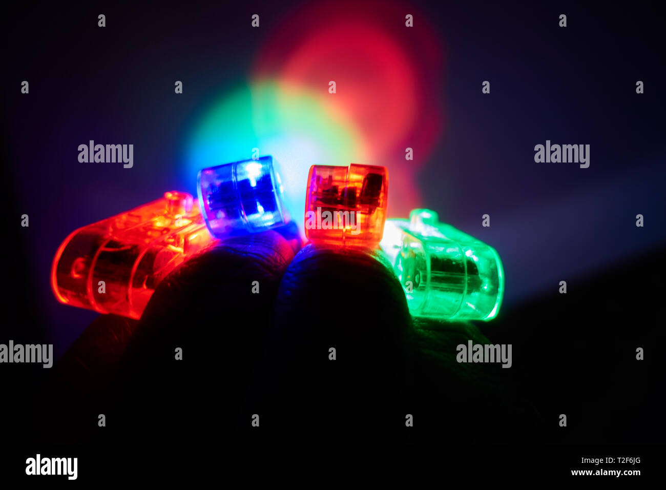 multi-color finger lights on outstretched hand Stock Photo - Alamy