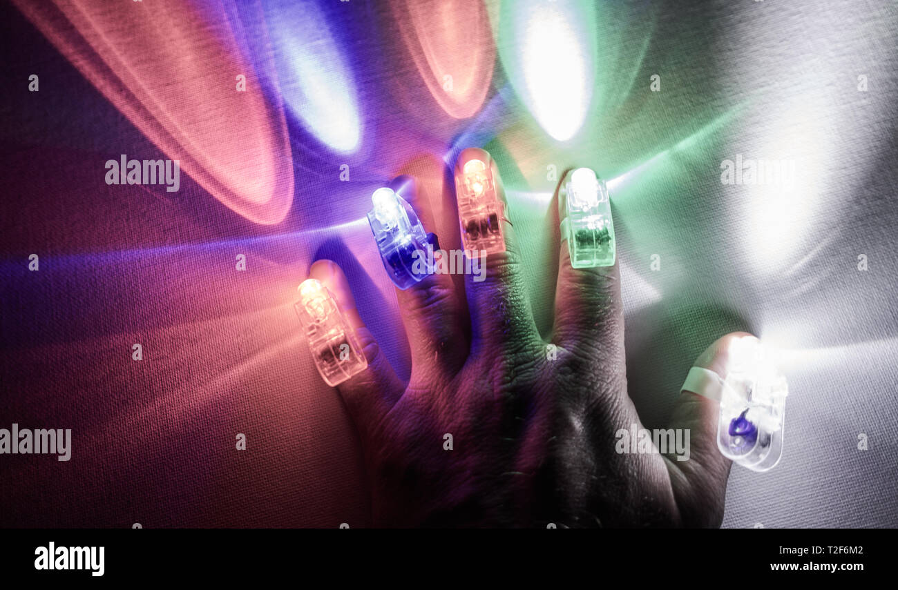 multi-color finger lights on outstretched hand Stock Photo - Alamy