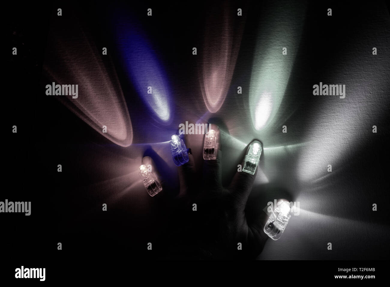 multi-color finger lights on outstretched hand Stock Photo - Alamy
