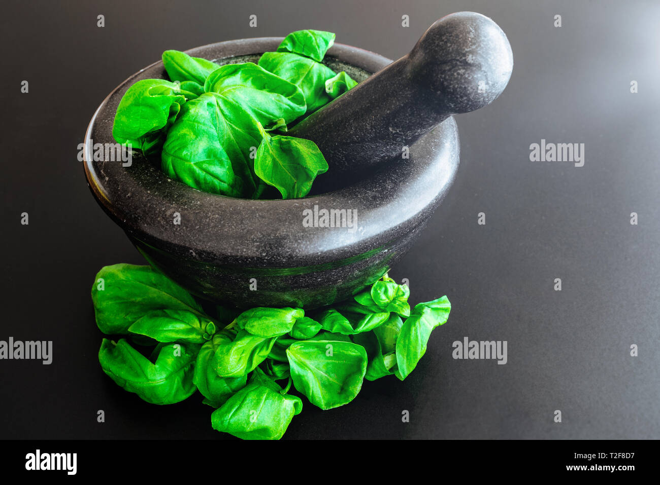 Fresh basil leaves in mortar hi-res stock photography and images - Alamy