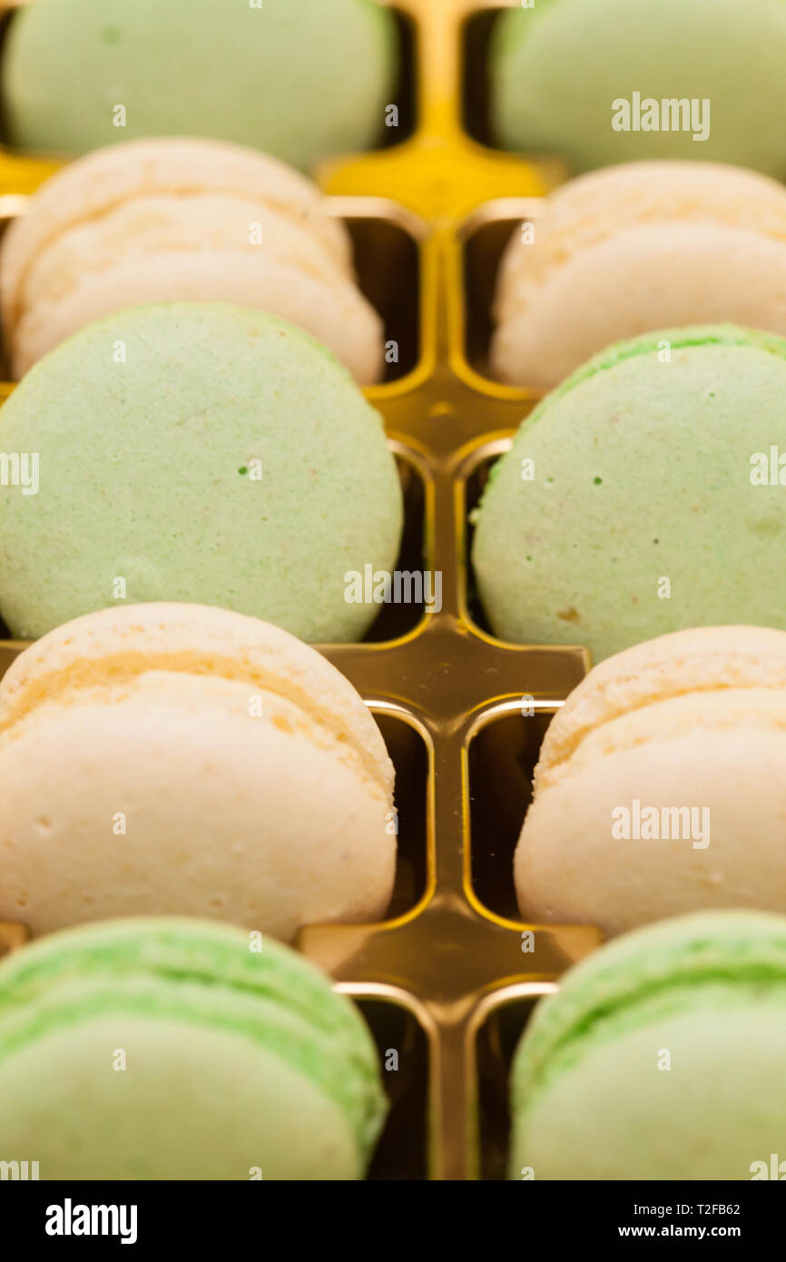 Row of colorful french macarons in the box. Traditional french dessert ...