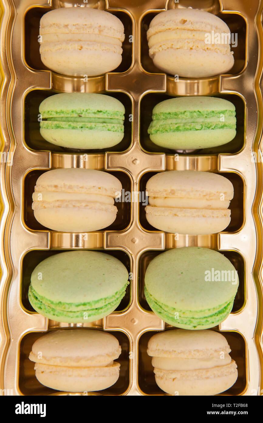 Traditional french sweets macarons in a golden box. Sweet dessert Stock ...