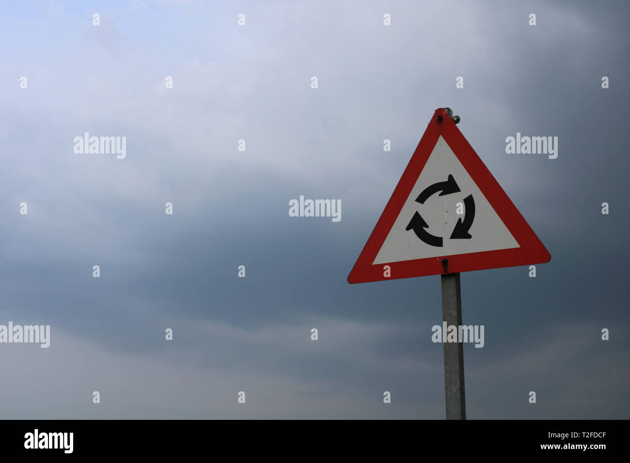 Round about street sign Stock Photo - Alamy