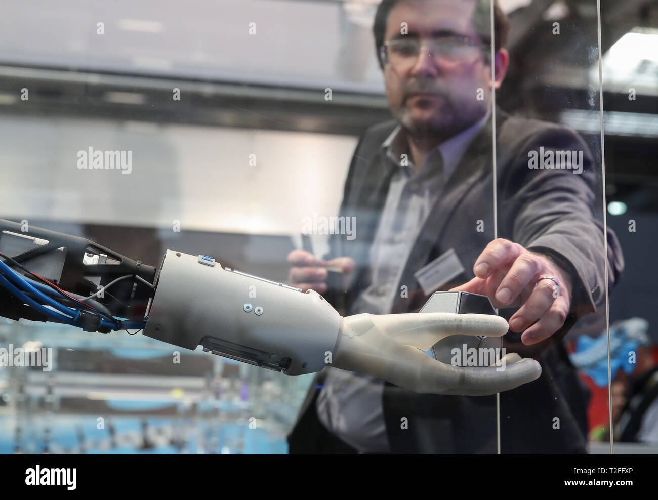 Beijing, Germany. 1st Apr, 2019. A staff member of the booth of Festo ...