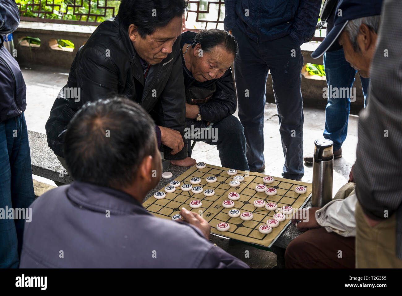 Locals playing Go, a popular Chinese board game, in the Green Lake Park ...