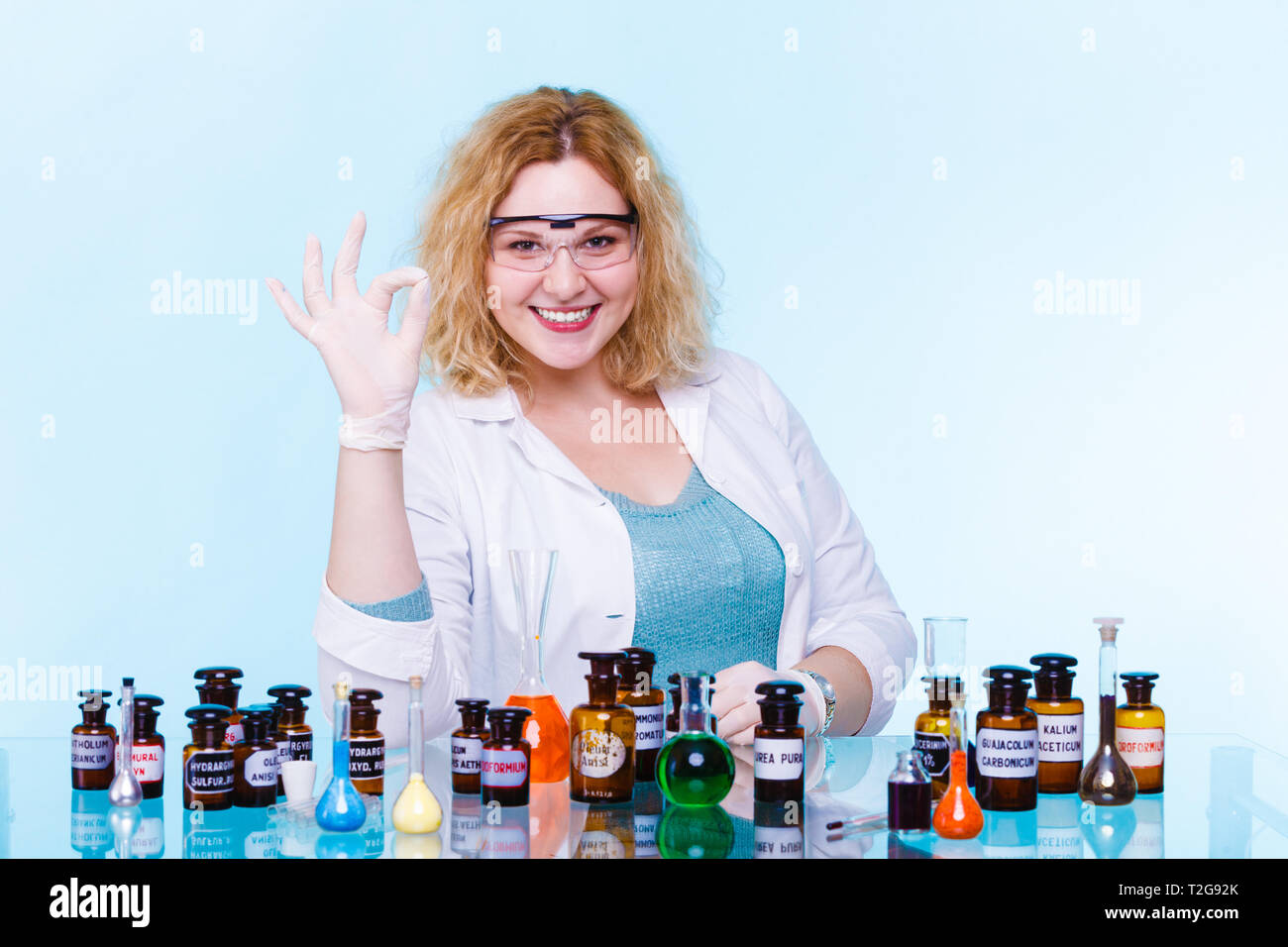 Experiments in laboratory. Happy chemist woman or student girl ...