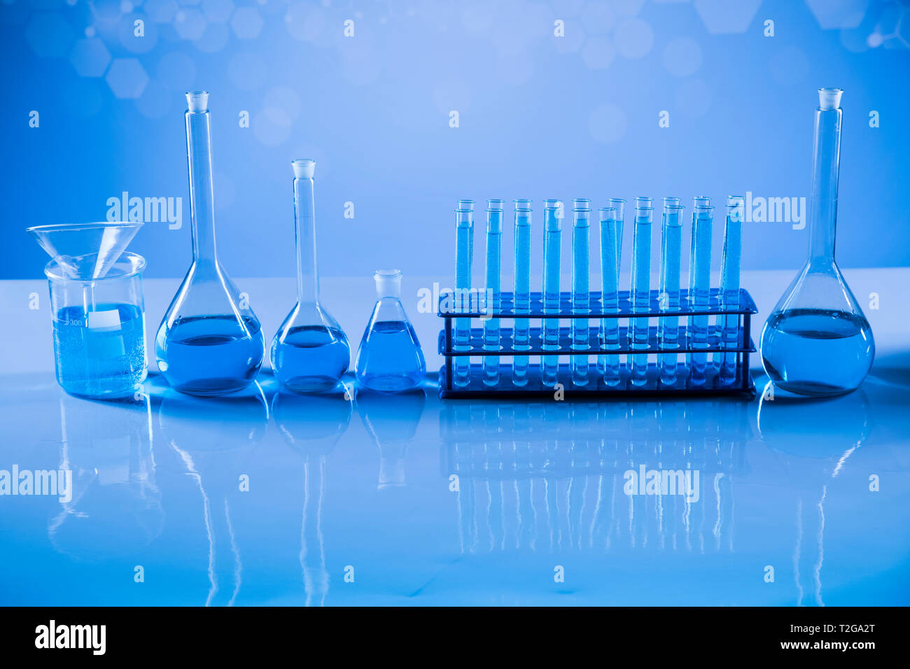 Laboratory beakers,Science experiment, blue background Stock Photo - Alamy
