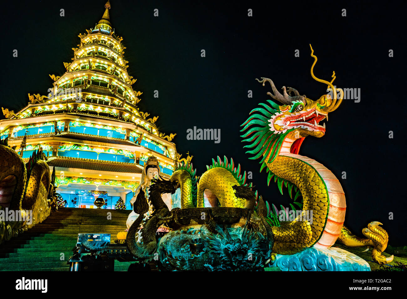 Beautiful dragon sculpture at night with dark sky background, Wat Huay Pla Kang, Chiang Rai ...
