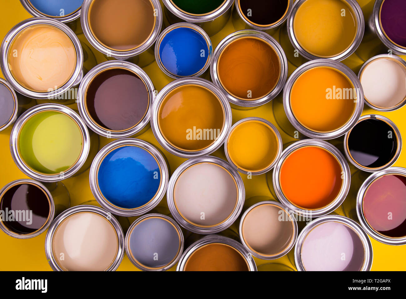 Paint cans color palette, yellow background Stock Photo - Alamy