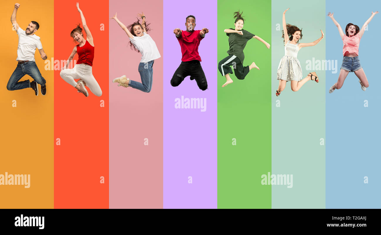 Freedom in moving. Happy young women and men jumping and gesturing ...